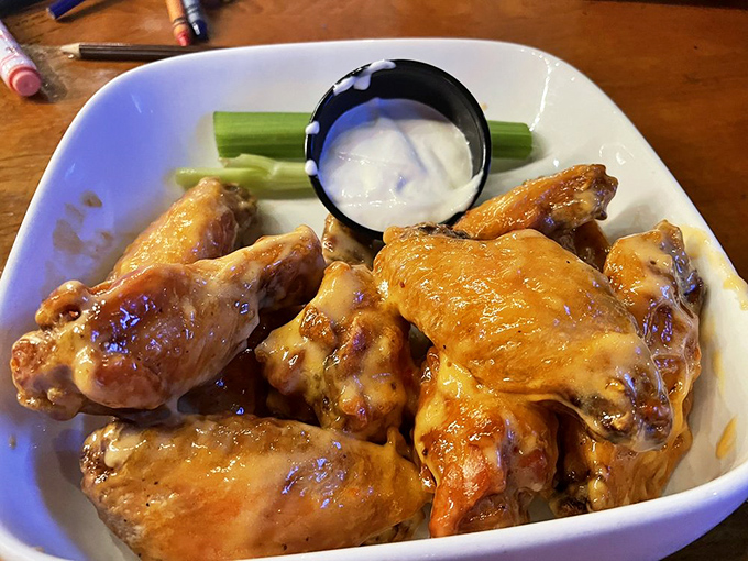 Wings so perfectly sauced they make you question whether napkins were invented specifically for this moment of messy, delicious bliss.