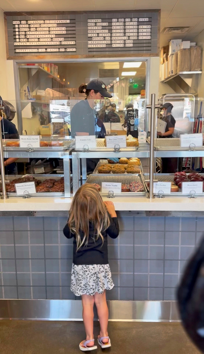 Even the smallest customers know greatness when they see it, standing on tiptoes for a glimpse of donut magic.