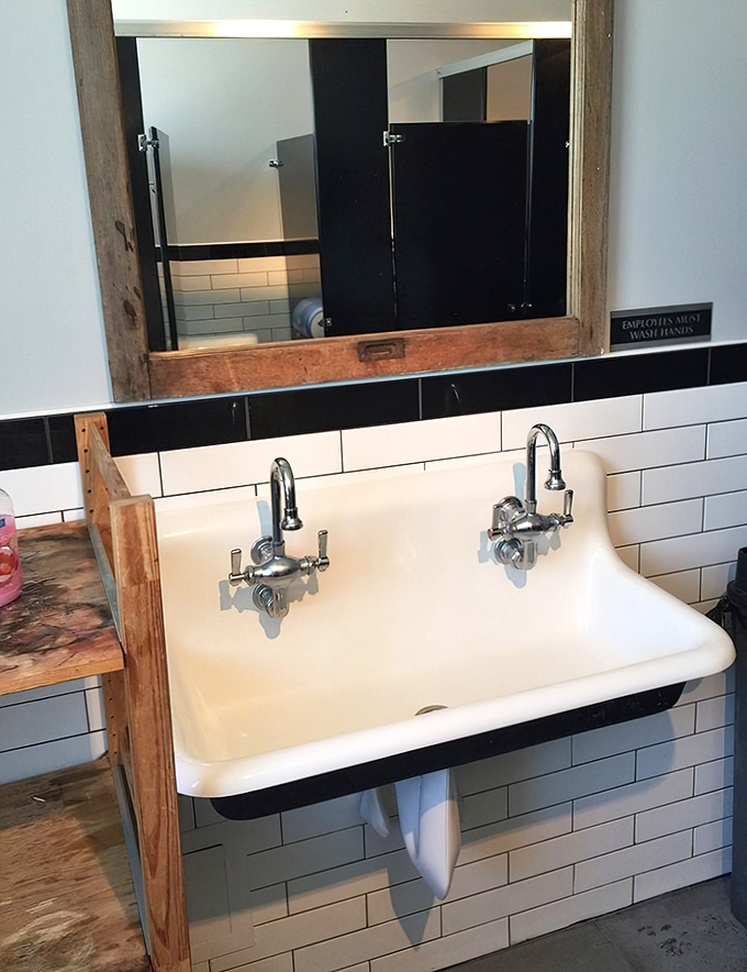 Even the restroom carries the nautical-industrial charm, proving The Shanty's attention to detail extends to every corner.