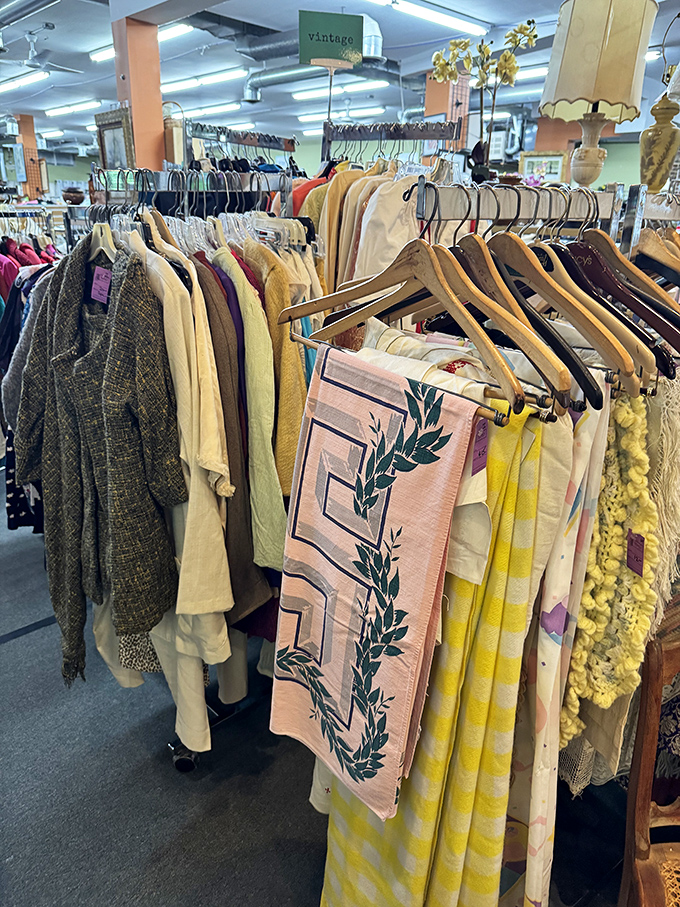 The vintage clothing section whispers of fashion eras past. That pink scarf might have witnessed disco, while the tweed jacket recalls professorial elegance.