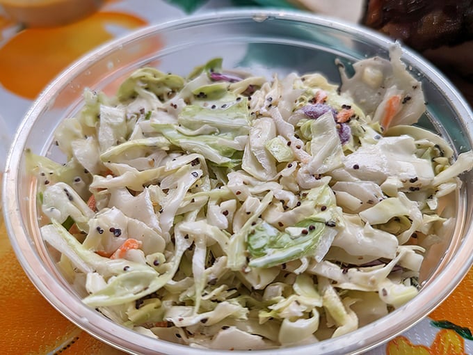 Coleslaw that refuses to be a mere side dish. Fresh, crunchy, and studded with poppy seeds&mdash;this is the supporting actor that steals the show.