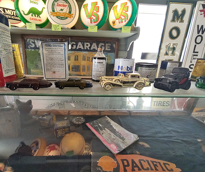 Miniature vintage cars lined up like they're at the world's most nostalgic traffic jam. Each one a pocket-sized portal to automotive history.