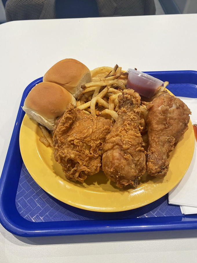 The plate that launched a thousand food comas. Fried chicken, rolls, and fries &ndash; a Southern trinity that makes you want to hug the cook.