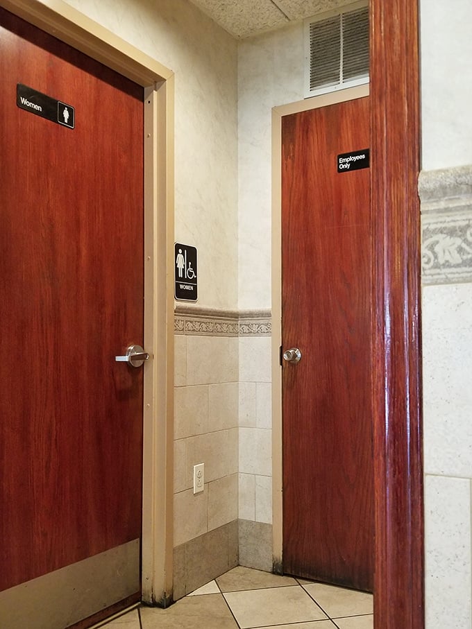 Even the restroom doors maintain that classic pizzeria aesthetic. No fancy design needed when the food does all the talking.
