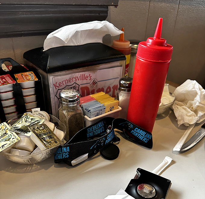 The table essentials &ndash; ketchup, mustard, sweeteners, and napkins &ndash; humble supporting actors in the grand theater of dining.