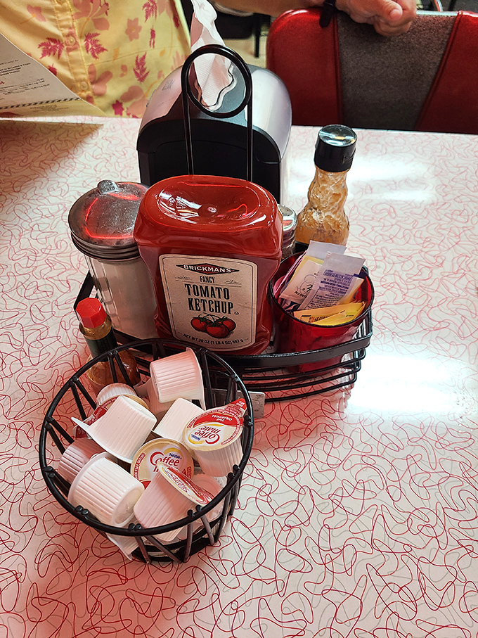 The condiment caddy &ndash; that tabletop necessity housing the sweet, savory, and caffeinated essentials for customizing your diner experience to perfection.