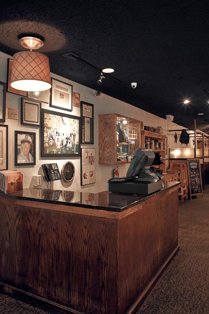 At the host stand, decades of hospitality await – wood paneling, memorabilia, and the promise of meat-induced happiness just beyond.