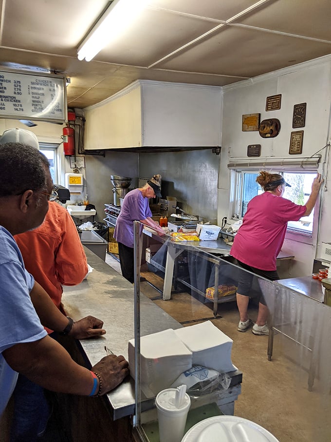 Behind the counter is where the magic happens, with staff who've likely forgotten more about barbecue than most chefs will ever know.