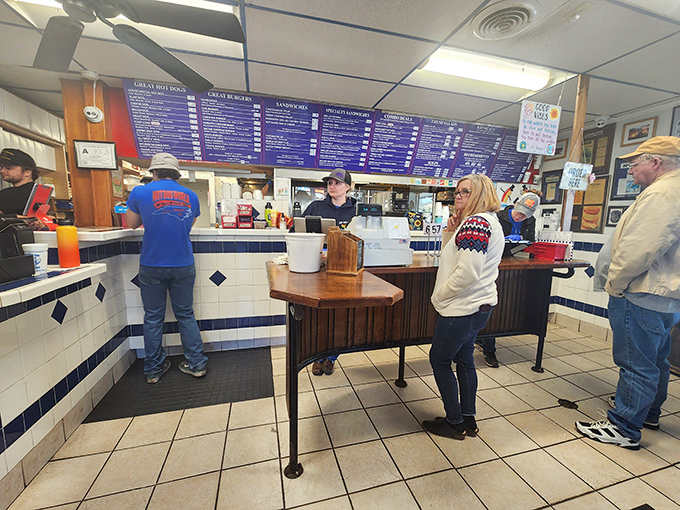 At the counter, where the magic happens, staff members orchestrate the daily symphony of grilling, topping, and serving that keeps locals coming back.