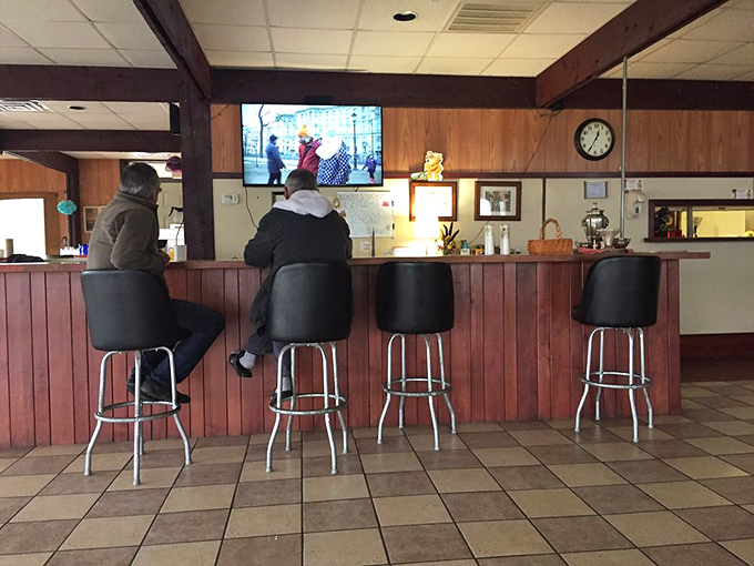 The bar seating offers front-row tickets to the culinary show. Sometimes the best dining companions are strangers with equally good taste.