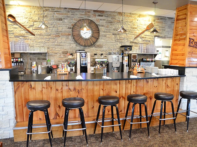 Bar seating for the breakfast theater. Those giant wooden utensils on the wall aren't subtle, but neither is your hunger.