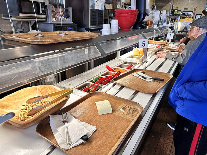 The cafeteria line &ndash; where decisions are made, anticipation builds, and you can almost hear your arteries protesting (but your taste buds cheering).