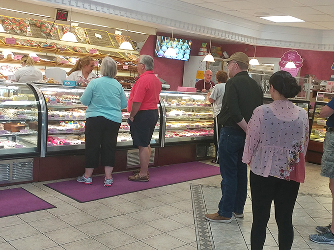 The bustling counter scene where sweet dreams come true and decisions become deliciously difficult for every eager customer.