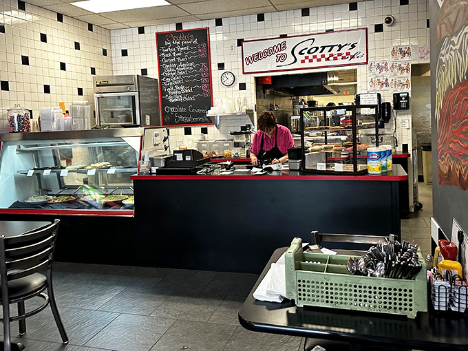 Where the magic happens. The counter area buzzes with efficiency as orders fly and the aroma of fresh coffee fills the air.