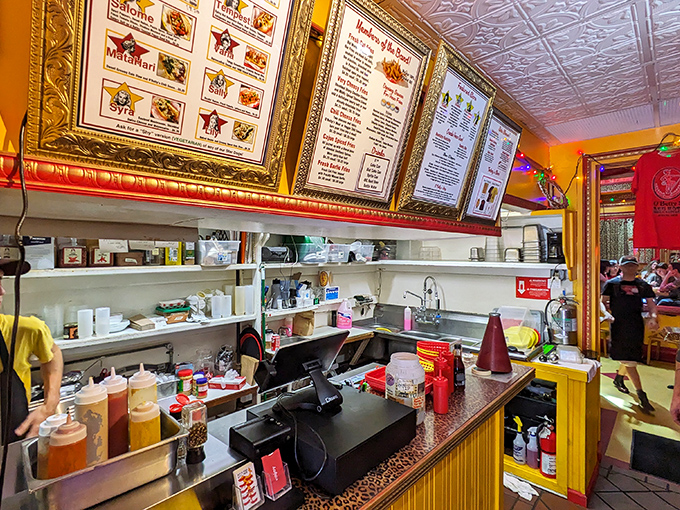Behind the counter, where hot dog magic happens, condiments stand at attention like soldiers ready for deployment on your frankfurter.