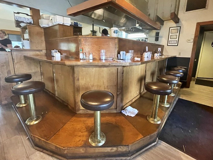 The counter seats&mdash;where solo diners become regulars and the breakfast show unfolds before your eyes. Prime real estate for French toast enthusiasts.