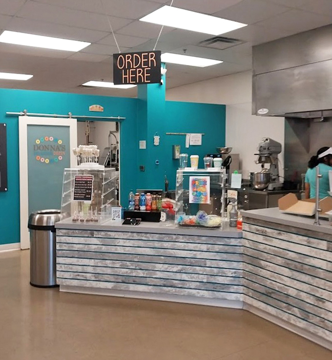 At the ordering counter, dreams come true under a neon "ORDER HERE" sign &ndash; three words that promise imminent donut satisfaction.