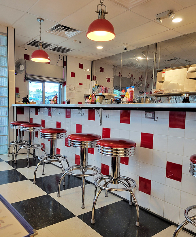 Those chrome-trimmed stools aren't just seating&mdash;they're front-row tickets to the greatest show on earth: short-order cooks performing breakfast ballet.