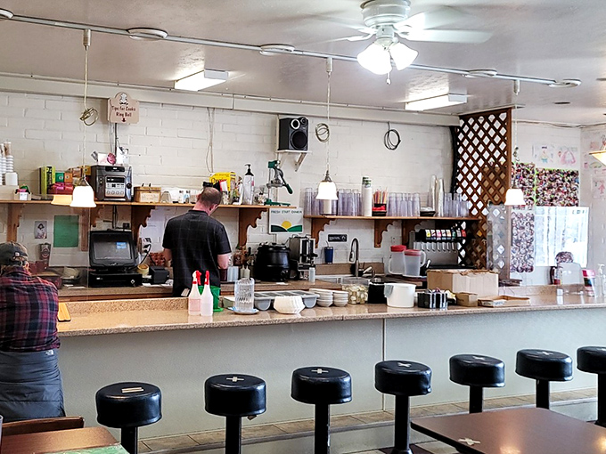Counter seats: the VIP section for solo diners and breakfast enthusiasts who appreciate the front-row view of culinary choreography.
