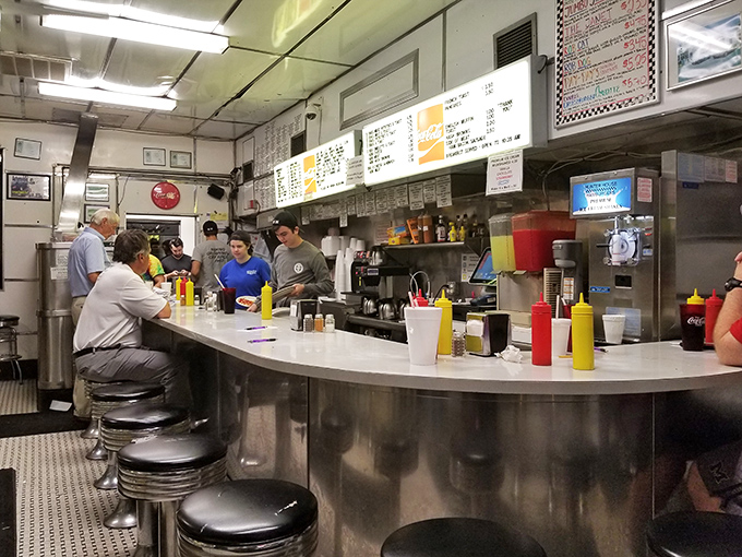 The counter seating isn't just functional&mdash;it's theater-in-the-round where diners become part of the Hunter House experience, watching culinary magic unfold.
