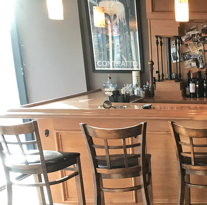 Bar seating: where solo diners become regulars and regulars become family, one martini at a time.