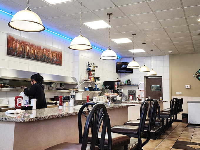 Counter seating where solo diners become philosophers and coffee cups never stay empty for long.