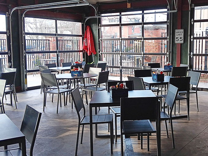 The covered patio offers al fresco dining with industrial flair – garage doors open to let in fresh air but not the Ohio weather's unpredictable moods.
