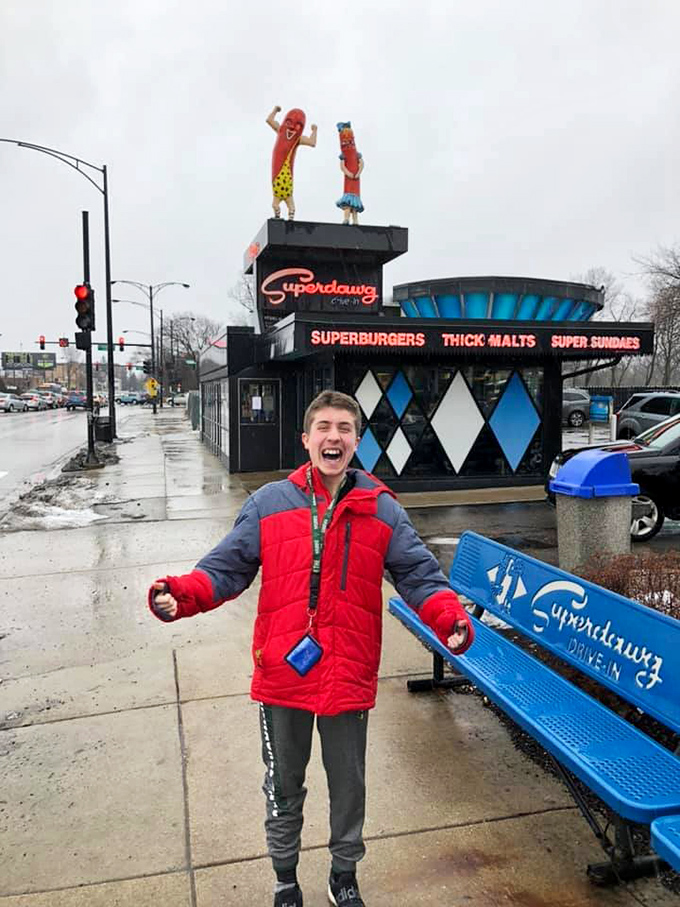 Pure joy captured outside Superdawg – the universal expression of someone who's about to experience a Chicago institution for the first time.