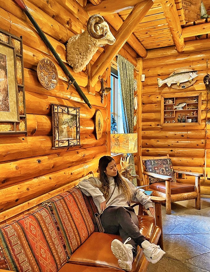 The log cabin interior creates the perfect backdrop for relaxation, where wilderness-inspired d&eacute;cor meets comfortable seating for lingering conversations.
