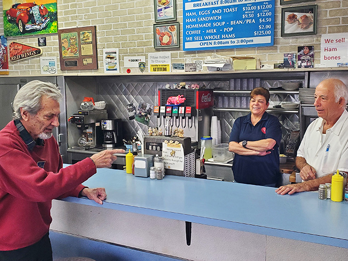 Conversations flow as naturally as coffee refills at Mike's, where regulars and staff share stories across the blue countertop that's witnessed decades of Detroit history.