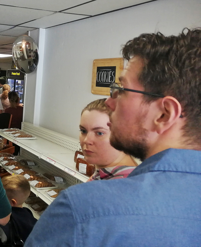 Happy customers savoring their treats prove that some experiences transcend age, bringing smiles to every generation present.