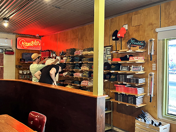 The merchandise corner where barbecue pilgrims transform into walking billboards. Because the only thing better than eating Franklin's is bragging about it afterward.