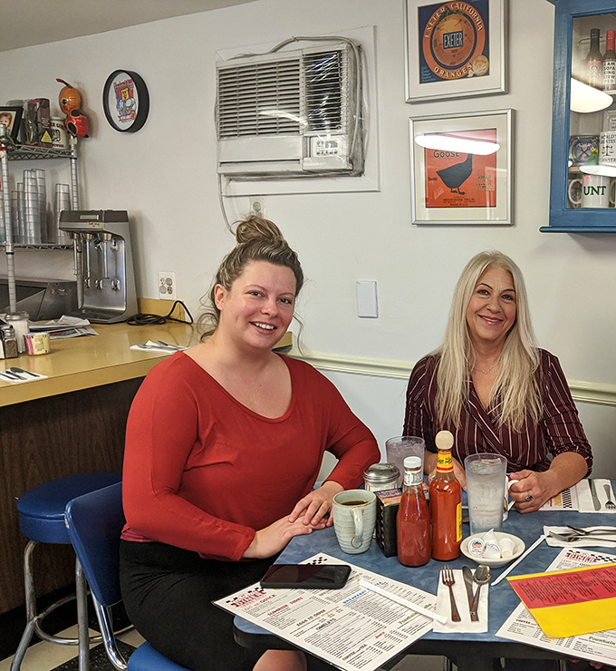 Where conversations flow as freely as the coffee refills. The diner's true magic happens when locals gather around these tables.