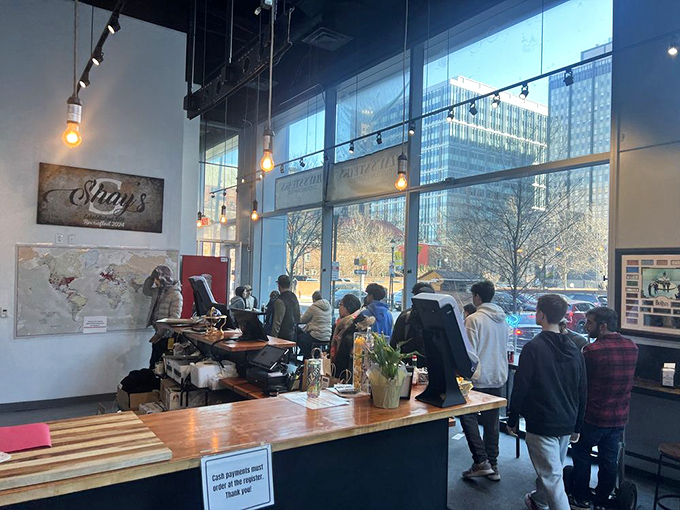 The floor-to-ceiling windows flood the space with natural light, creating a gathering spot where Philly's sandwich seekers line up for their custom-crafted creations.