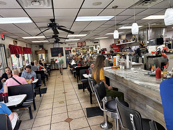 Where strangers become neighbors over coffee refills. The true Florida experience happens at these tables, not at theme parks.