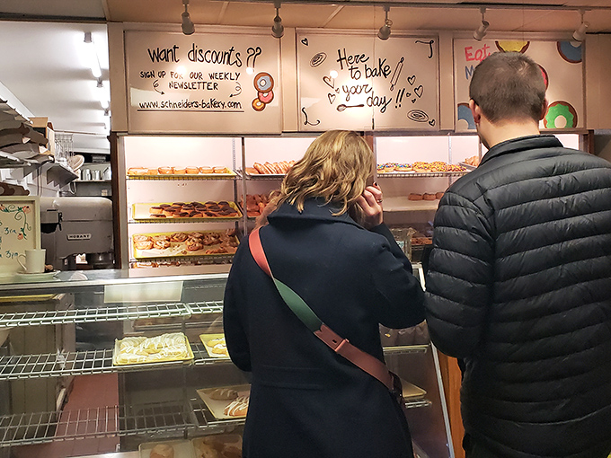 The universal language of anticipation. These customers know good things come to those who wait&mdash;especially when those good things are freshly made donuts.