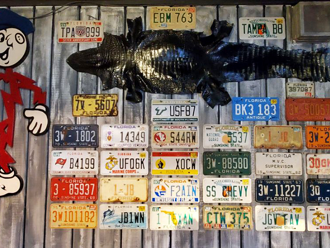 That mounted gator surveys the dining room like a satisfied customer who decided to stay permanently for the ambiance.