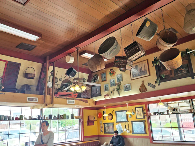 Buckets and baskets hang from the ceiling like trophies of simpler times, creating an atmosphere of nostalgic comfort.