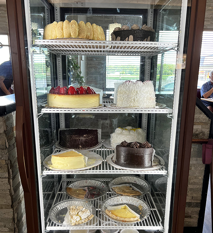 The dessert case&mdash;where willpower goes to die. Each shelf offers a different way to justify why today is definitely a "treat yourself" kind of day.