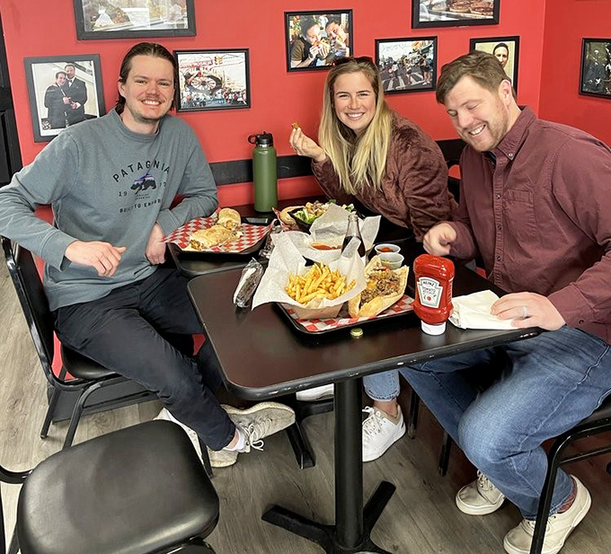 Happy faces around a table of serious sandwiches. This is what food is about&mdash;bringing people together over something worth sharing.