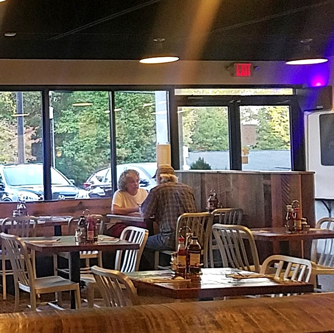 Conversations pause only for the important business of savoring each bite. These diners know the universal truth: good barbecue deserves your full attention.