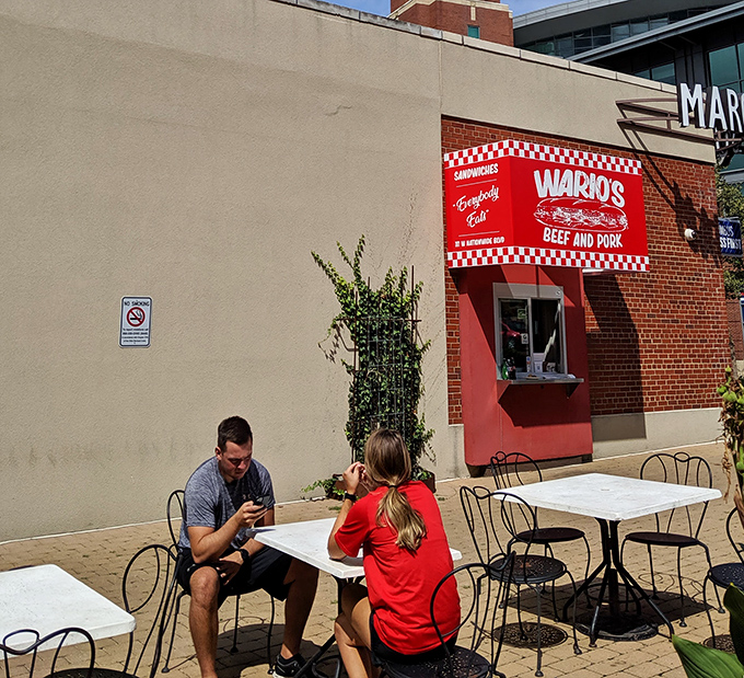 Sandwich enjoyment in its purest form: two people, two tables, and food worth photographing before the first magnificent bite.