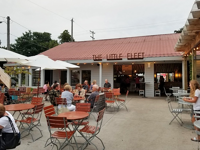 Summer evenings were made for this—conversations flowing as freely as the drinks, under Michigan's impossibly blue skies and distinctive red roof.