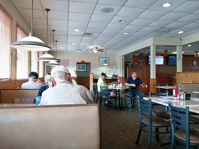 Morning regulars gather like a breakfast club, where coffee flows freely and everyone seems to know exactly which booth belongs to whom.