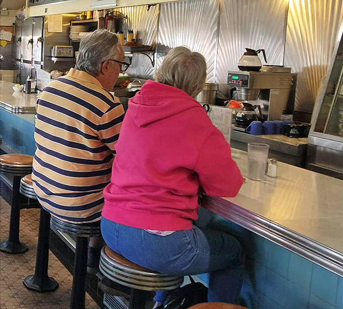 Regulars at the counter aren't just customers—they're the heartbeat of the place, trading stories as essential to the experience as the food itself.