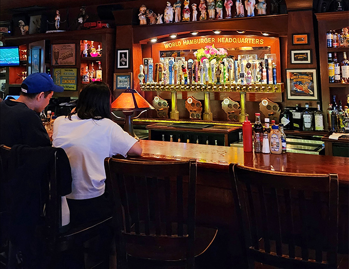The bar area isn't just serving drinks&mdash;it's serving community. "World Hamburger Headquarters" isn't just clever marketing; it's their mission statement. 