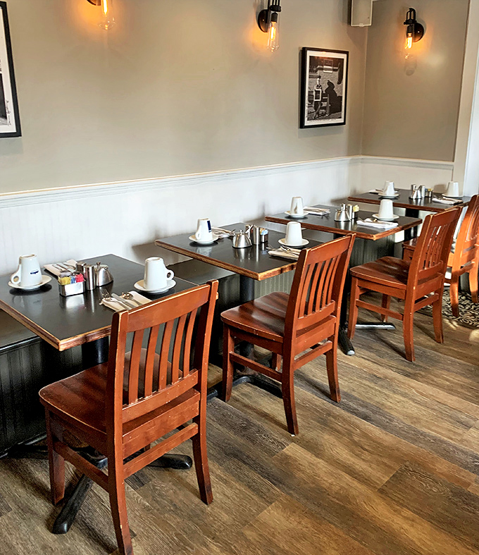 Tables set with anticipation&mdash;wooden chairs and simple settings that let the food be the star of this breakfast show.