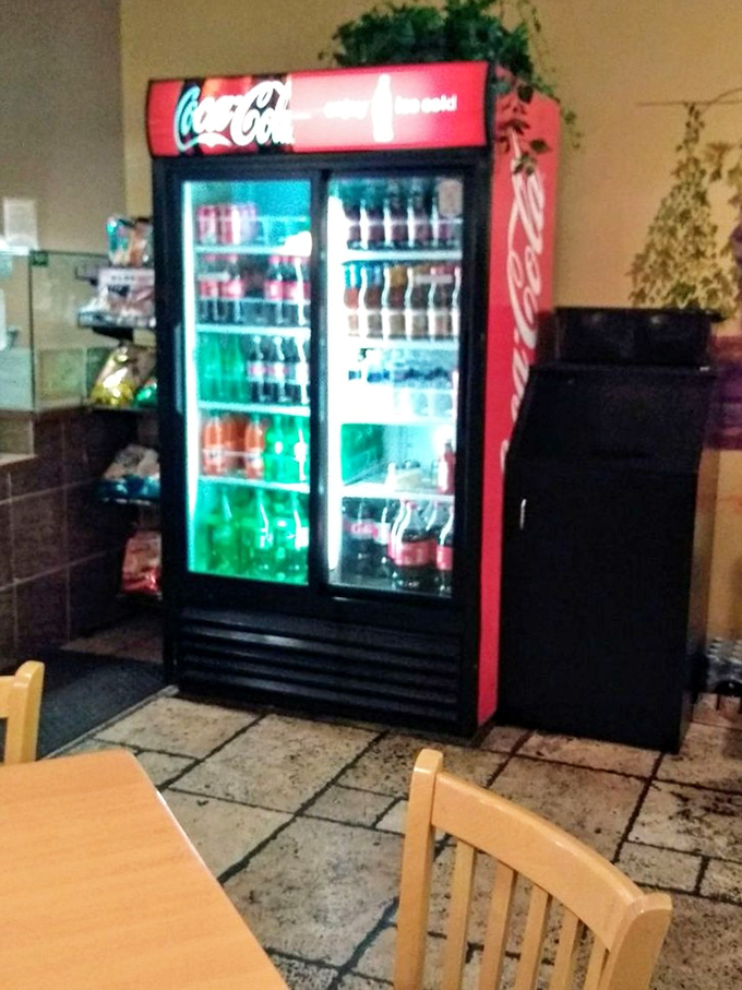 The classic soda cooler, humming with promise of ice-cold refreshment to complement the parade of Italian-American delights heading to your table.