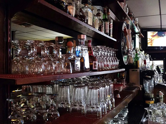 Behind every great steakhouse is a well-stocked bar. These shelves hold the liquid ingredients for memorable evenings and spirited conversations.