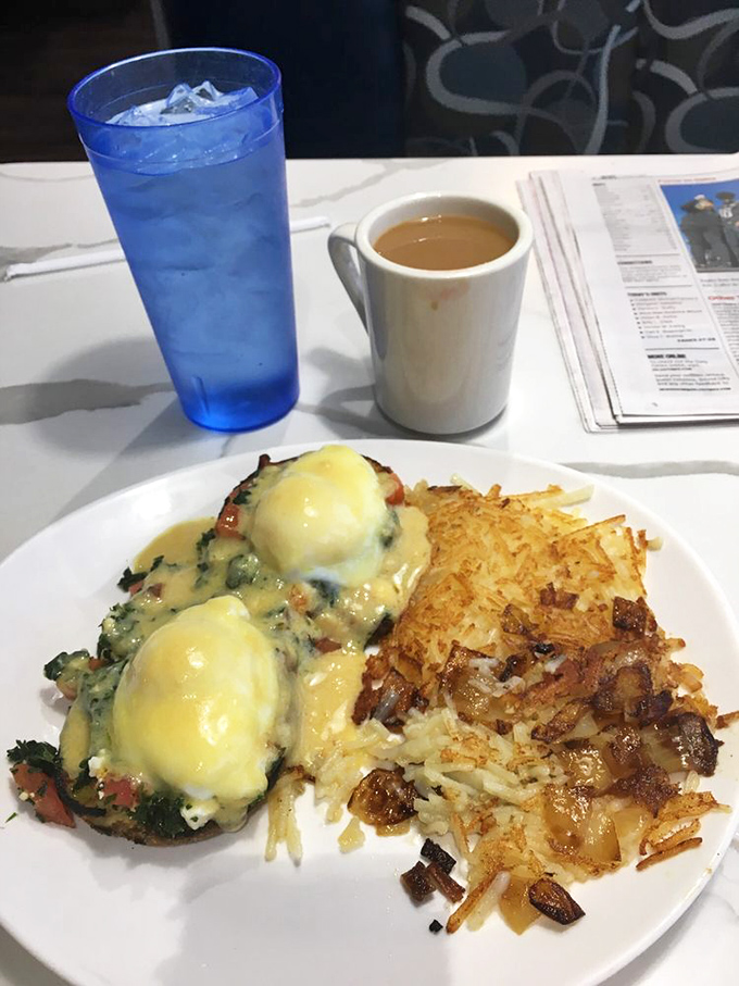 Eggs Benedict with a side of crispy potatoes—the breakfast equivalent of wearing a tuxedo with really comfortable shoes.